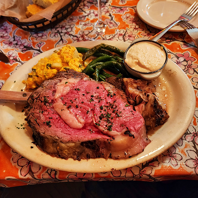 Behold the star of the show: prime rib cooked to ruby-red perfection, accompanied by sides that know their supporting role in this meaty masterpiece.
