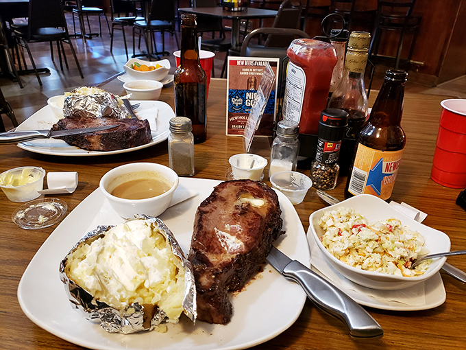 Behold the star of the show! This prime rib, paired with a loaded baked potato and coleslaw, is what food dreams are made of.