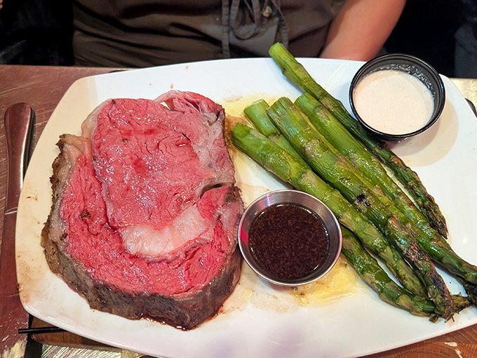 This isn't just prime rib—it's a carnivore's dream realized, perfectly pink and accompanied by asparagus that actually deserves to share the plate.