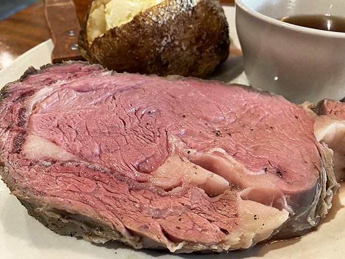 This prime rib doesn't just melt in your mouth—it practically serenades your taste buds. The baked potato stands by like a loyal sidekick.