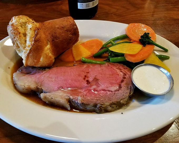 
Prime rib perfection: that rosy center, golden Yorkshire pudding, and horseradish cream form a triumvirate of flavor that justifies the drive. 