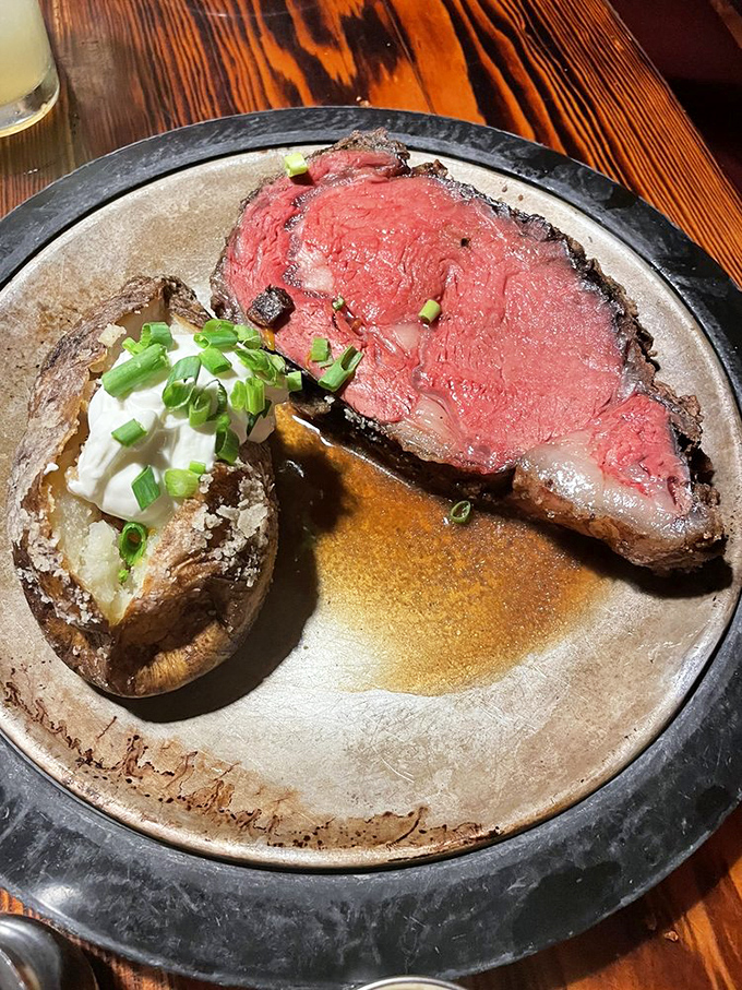 This prime rib isn't just cooked—it's honored. Perfectly pink, juicy, and accompanied by a loaded baked potato that deserves its own zip code.