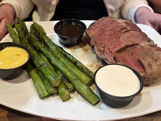 Prime rib cooked to that perfect shade of pink, accompanied by asparagus that actually deserves to share the plate. This is beef's happy place.