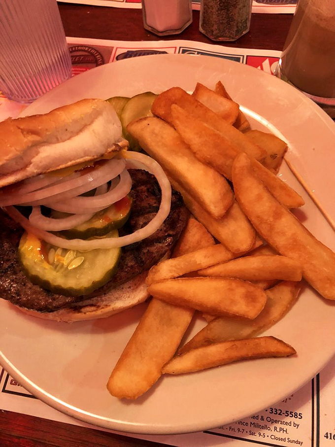 This burger isn't just food; it's architecture. Notice how those perfectly crisp fries stand at attention, ready for their potato purpose.