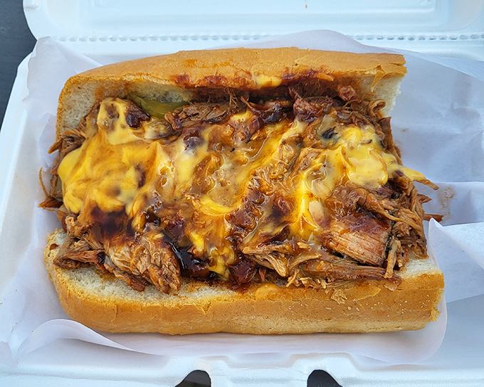 Pulled pork drowning in melted cheese&mdash;a beautiful disaster you'll happily clean up with every bite. Napkins required, regrets impossible.