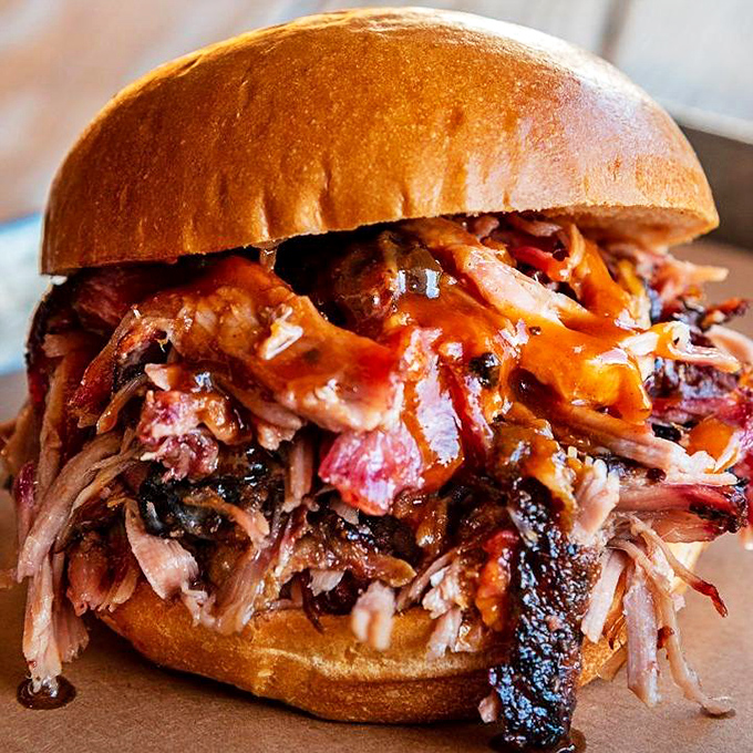 This isn't just a sandwich; it's a pulled pork masterpiece that makes you wonder if you've been eating sandwiches wrong your entire life.