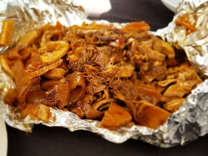 Glistening carnitas in all their glory. This isn't just pulled pork&mdash;it's a masterclass in patience, rendered fat, and culinary alchemy.