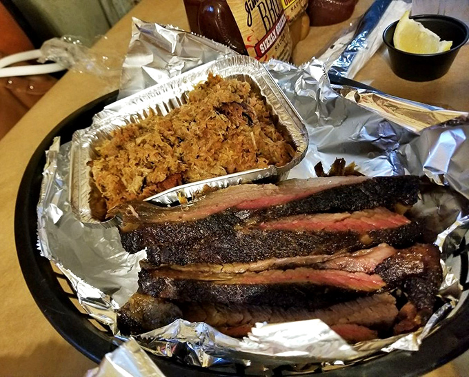 Behold the dynamic duo: tender pulled pork and sliced brisket that'll make you question previous life choices.