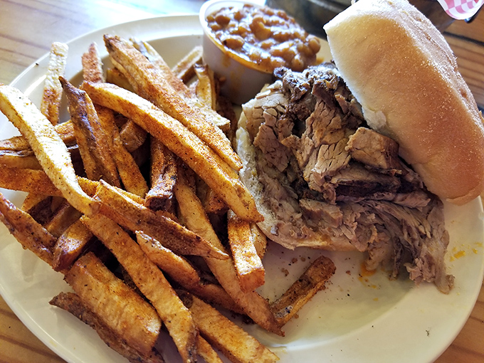 This pulled pork sandwich arrives ready to challenge everything you thought you knew about barbecue.