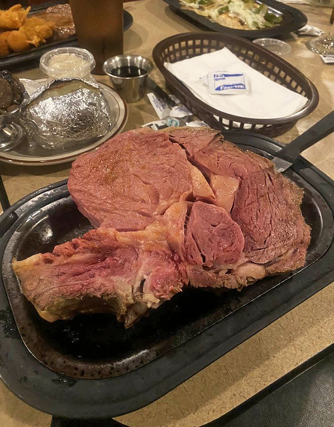 Not so much a portion as a statement of purpose—this prime rib doesn't just hang off the plate, it commands respect.