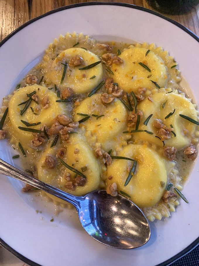 Golden pillows of pasta perfection. These ravioli aren't just served &ndash; they're presented like the culinary treasures they are.