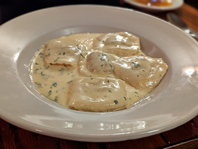 Pillowy ravioli swimming in a silky cream sauce&mdash;this isn't just dinner, it's a religious experience that demands a moment of respectful silence.