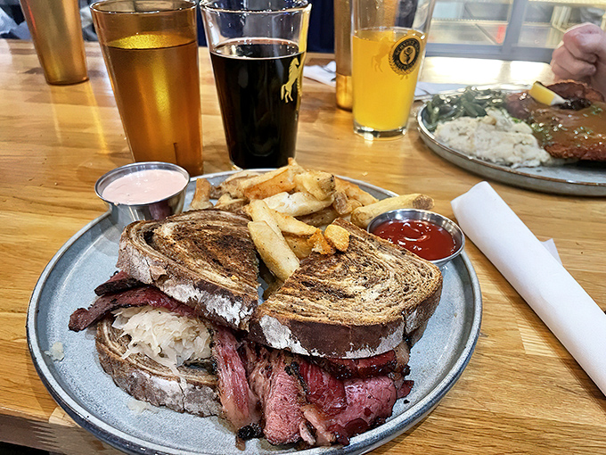 The star of the show in all its glory&mdash;marble rye bookending a mountain of house-smoked meat. This isn't just a sandwich; it's architecture with flavor credentials.