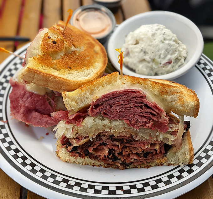 Behold the Reuben in its natural habitat &ndash; a masterpiece of engineering where corned beef, sauerkraut, and Swiss cheese achieve perfect harmony.