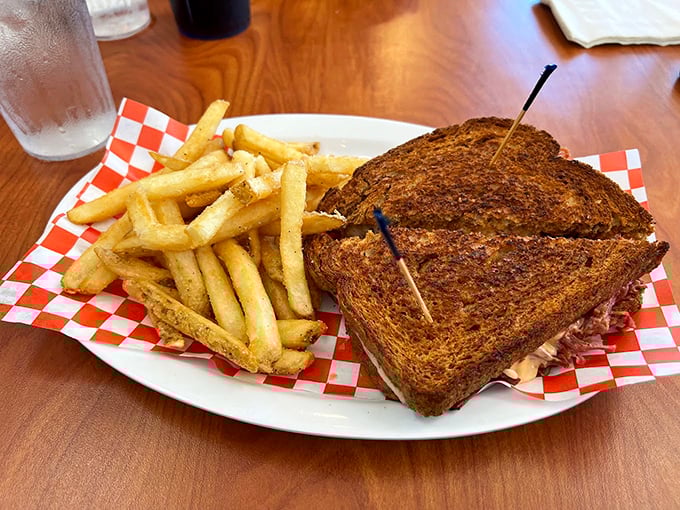 The legendary Reuben arrives like a sandwich superhero&mdash;perfectly grilled rye bread, homemade corned beef, and just the right ratio of sauerkraut to Russian dressing. Kryptonite for diets everywhere.