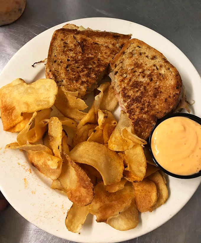 The sandwich that launched a thousand road trips. Golden-grilled rye embraces perfectly balanced corned beef, sauerkraut, and Swiss in this legendary Reuben.