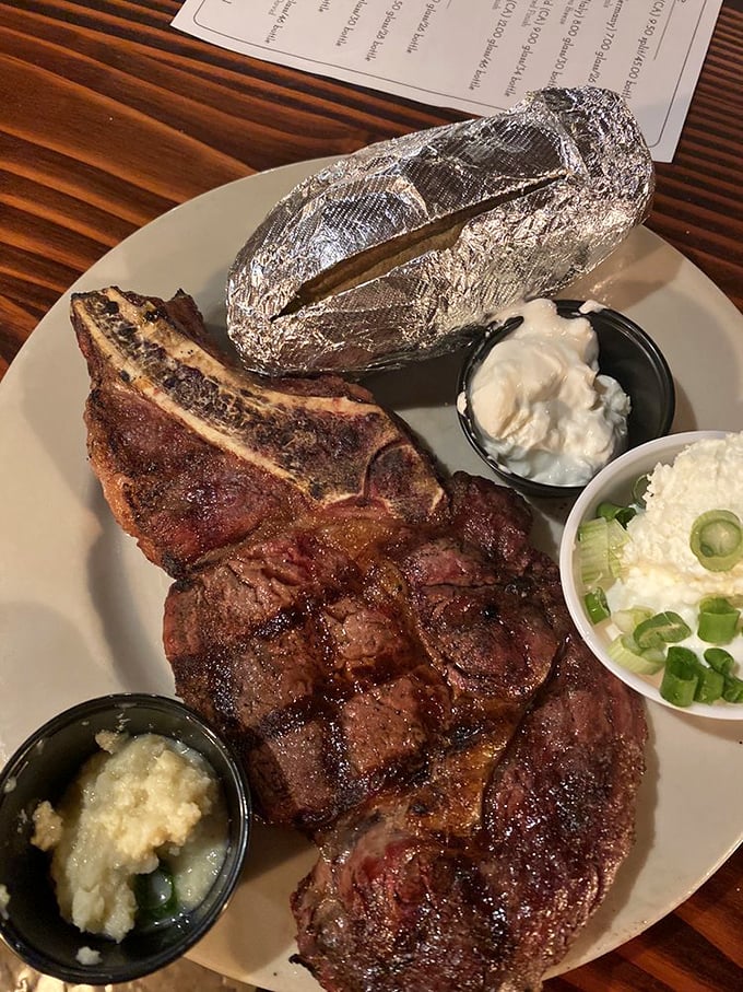 This ribeye isn't just dinner; it's a masterpiece of marbling with sides that know their supporting role in this meaty blockbuster.