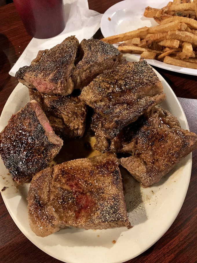 Behold the star of the show&mdash;a perfectly seasoned ribeye with that magical char that whispers, "Yes, this was worth the drive."
