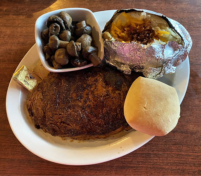 This isn't just a steak; it's a declaration of independence from mediocre meals. The loaded baked potato and saut&eacute;ed mushrooms are worthy sidekicks.
