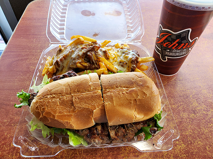 This isn't just lunch, it's an architectural marvel&mdash;a ribeye sandwich foundation supporting a glorious skyscraper of chili cheese fries.