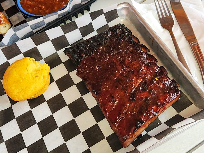 These ribs don't just fall off the bone&mdash;they practically leap onto your fork, their mahogany glaze glistening like edible stained glass.