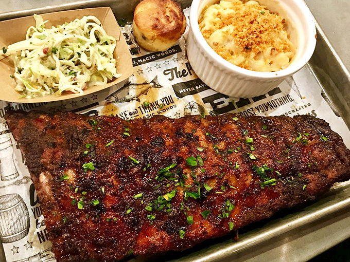 Behold, the rack of ribs that launched a thousand return visits. That bark, that glaze, that perfect chive garnish&mdash;barbecue nirvana achieved.