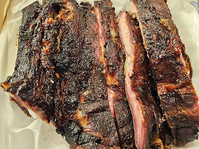 Behold the bark! These ribs have the kind of smoke ring that makes barbecue aficionados go weak in the knees.