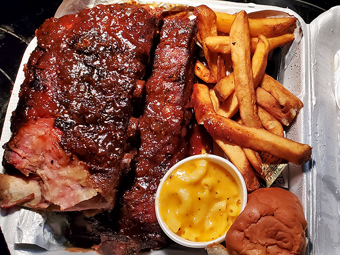 Glistening with sauce and sporting that perfect pink smoke ring, these ribs aren't just food &ndash; they're edible evidence that patience is delicious.