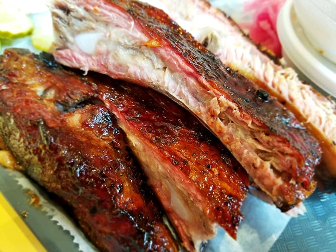 These aren't just ribs; they're edible evidence that patience is a virtue. That smoke ring is the barbecue equivalent of a Michelin star.