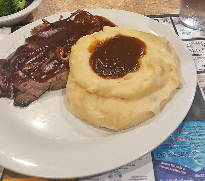 Behold the star attraction: roast beef swimming in gravy with mashed potatoes standing by as willing accomplices.