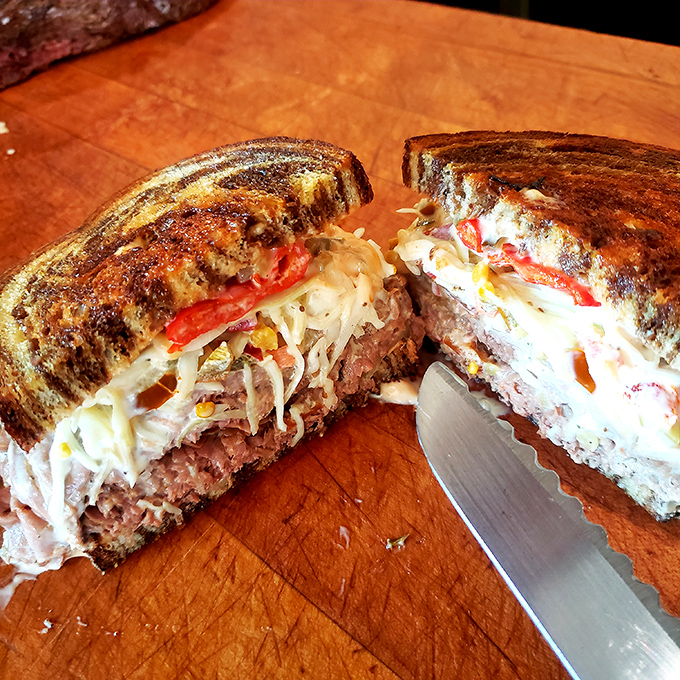 Behold the sandwich equivalent of a symphony &ndash; layers of perfectly carved meat, melted cheese, and toasted bread in harmonious balance.