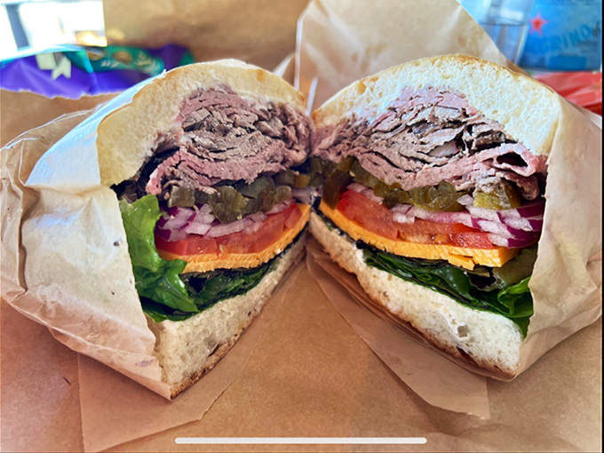 This isn't just a sandwich—it's architecture. Layers of roast beef, veggies, and condiments create the skyscraper of lunch you've been dreaming about.