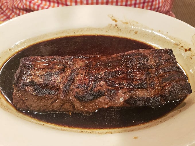 The Romanian steak swimming in its savory au jus isn't just dinner &ndash; it's a religious experience that makes you want to start a support group.