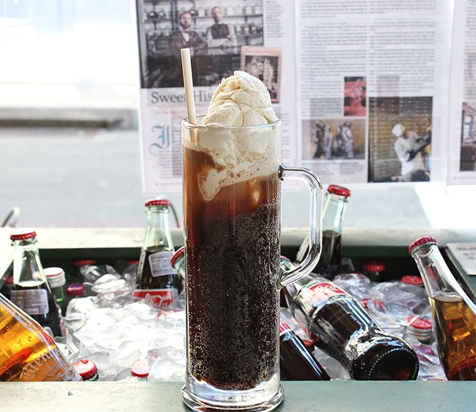 Behold the engineering marvel that transforms simple ingredients into liquid nostalgia served in a perfect glass vessel.