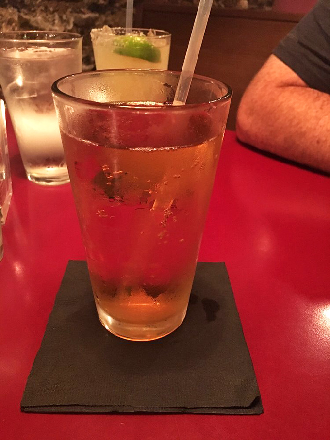 That's not just any beverage&mdash;it's liquid amber perfection in a glass, condensation beading on the side like nature's own promise of refreshment.