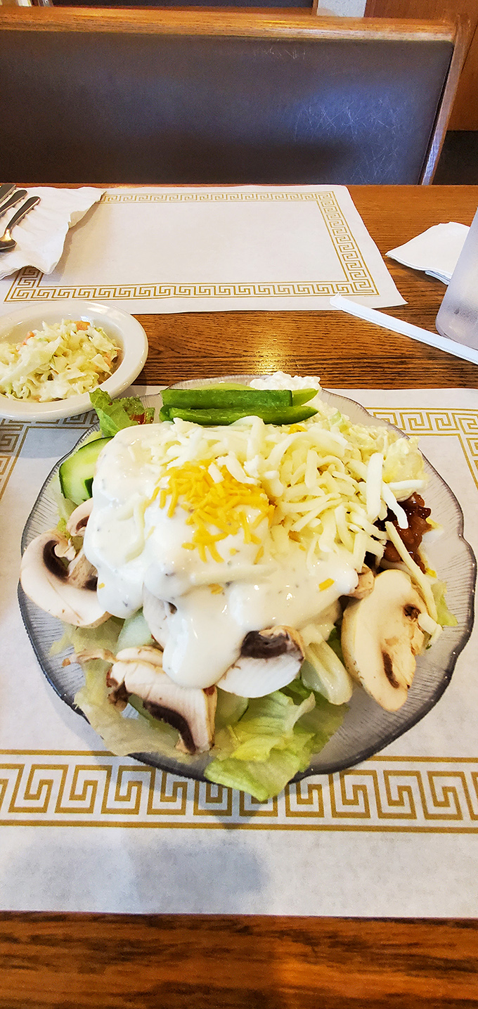 This isn't just any salad—it's a masterpiece of fresh ingredients crowned with house-made dressing and cheese. The salad bar's reputation is well-earned.