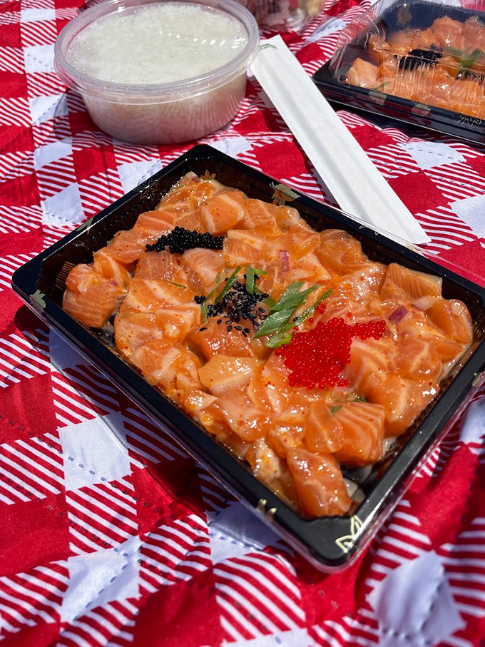 This salmon poke is the aquatic equivalent of a sunset &ndash; vibrant orange cubes glistening with marinade, topped with tobiko that pops like tiny flavor fireworks.