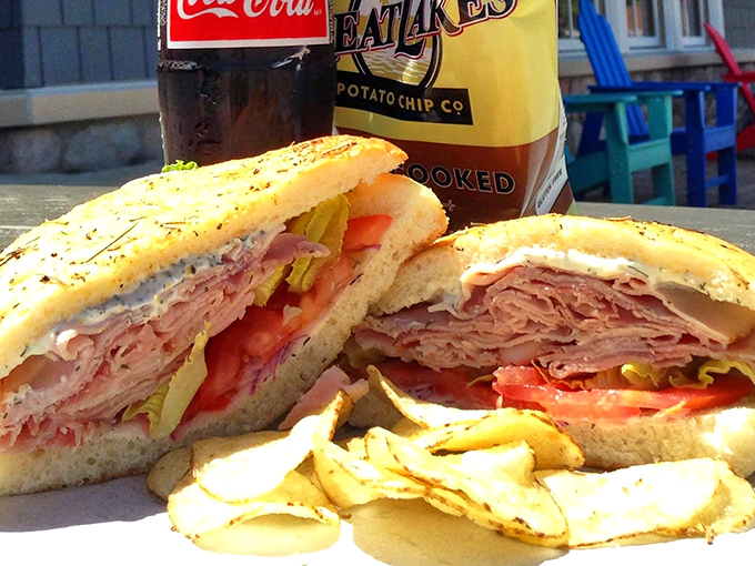 Not just a sandwich, but an architectural masterpiece of perfectly stacked meats, fresh veggies, and bread that hits that magical balance between soft and sturdy.