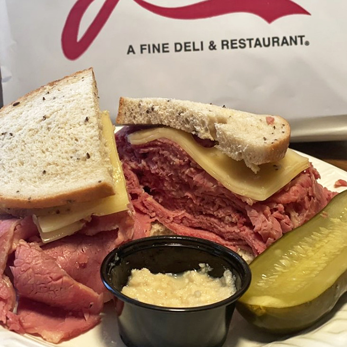 Behold the architectural marvel that is Joe's corned beef sandwich&mdash;where meat and bread achieve perfect harmony, with a pickle standing guard.