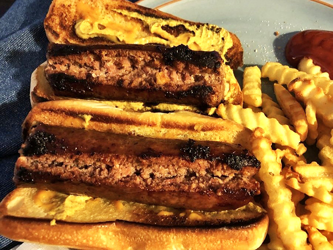 These golden sausage dogs are the stuff of legend, grilled to perfection with crispy fries.