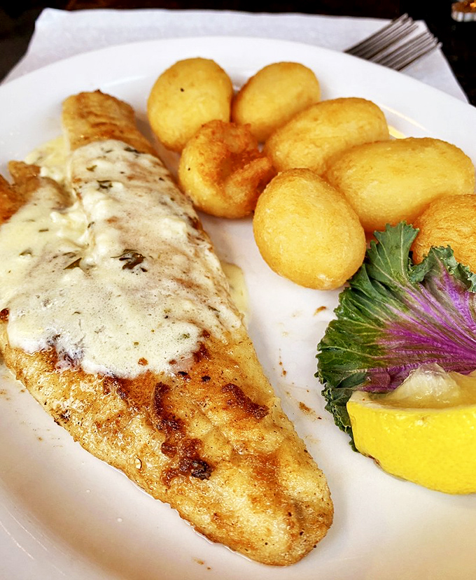 Behold the star of the show: saut&eacute;ed walleye with golden potato puffs. That fish has a tan better than anything I achieved all summer.
