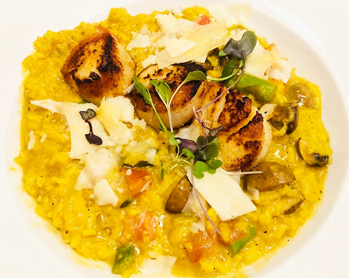 Perfectly seared scallops crown a golden risotto throne &ndash; this dish alone is worth the drive to Akron, even if your GPS protests.