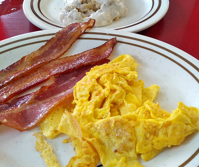 Golden scrambled eggs that would make Julia Child nod approvingly over her morning coffee.