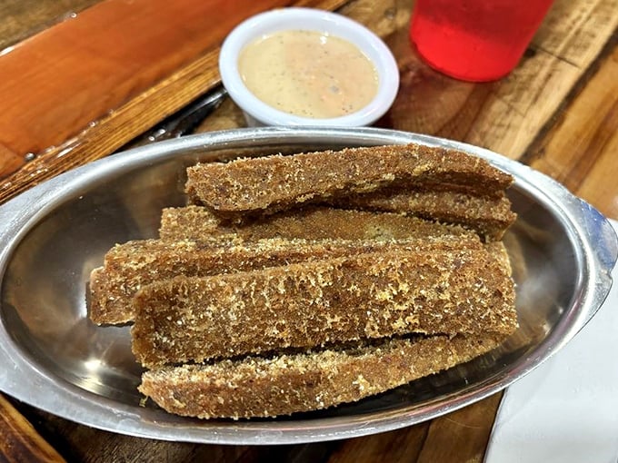 Golden-brown scrapple sticks &ndash; Pennsylvania's contribution to breakfast civilization &ndash; crispy outside, tender inside, and worth every adventurous bite.