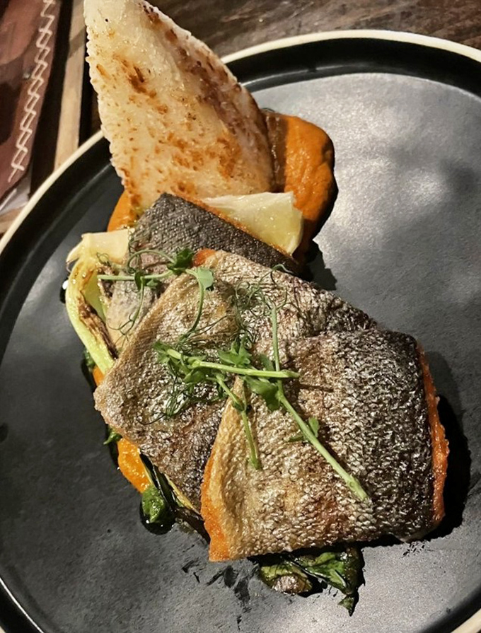 Perfectly seared sea bass that would make Neptune himself put down his trident and pick up a fork instead.