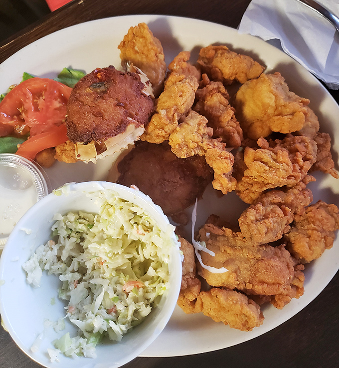 Golden-fried perfection with sides that know their supporting role. That deviled crab might be worth the drive from Atlanta alone.