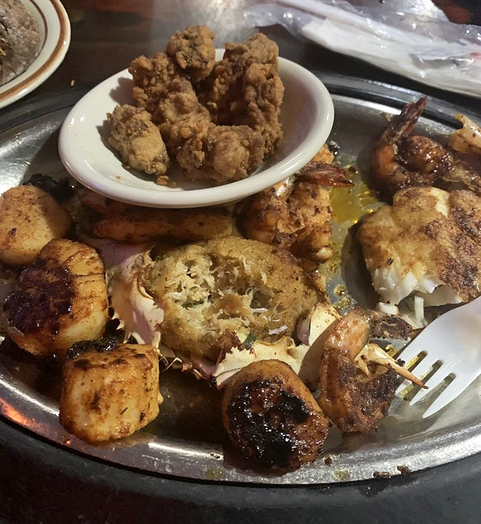 A seafood medley that would make Neptune himself jealous. Golden fried morsels and perfectly seared scallops share the spotlight on this oceanic platter.