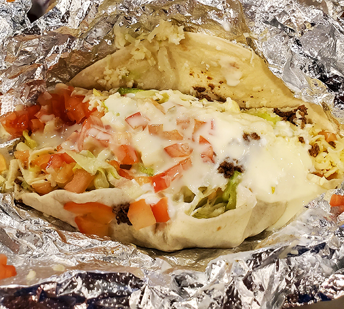Behold the seafood burrito in its foil-wrapped glory! Like opening a treasure chest where X marks the spot for your taste buds. 