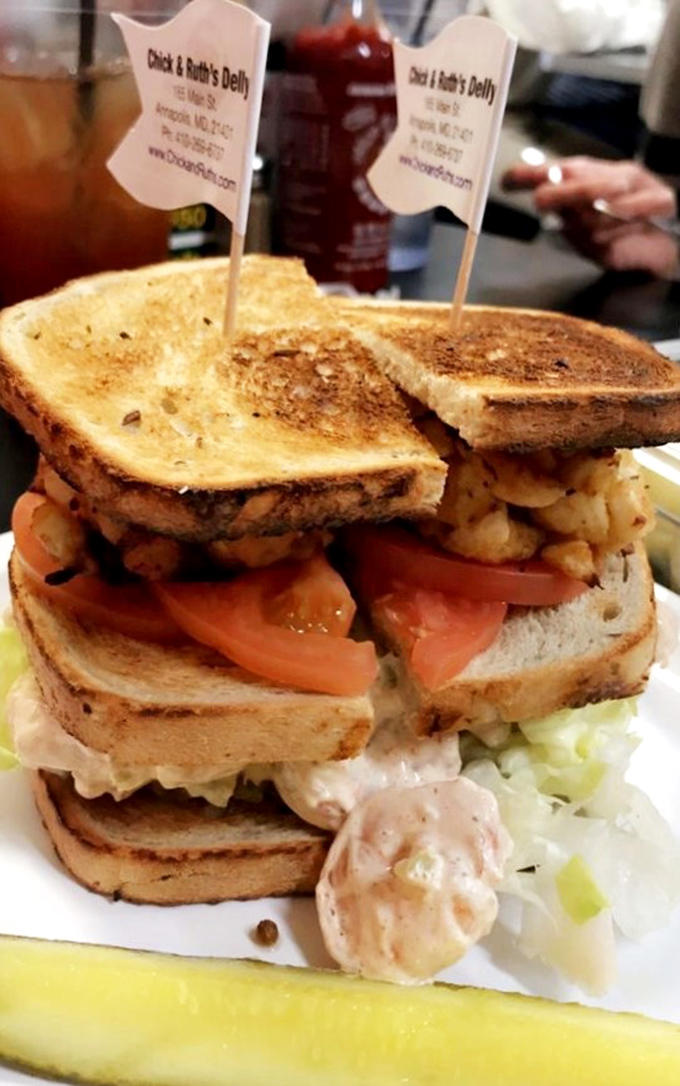 Architectural marvel or sandwich? This towering creation requires structural engineering skills just to take the first bite.