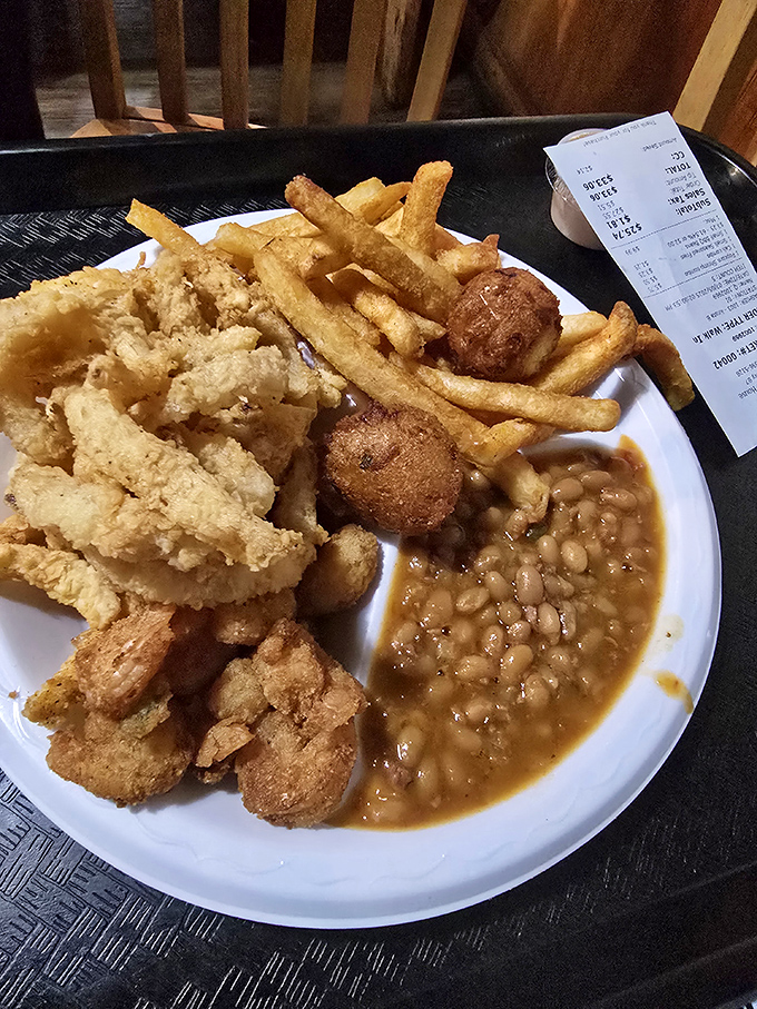 Seafood nirvana on a plate: golden-fried treasures, crispy fries, and beans that would make your grandma jealous. Diet plans, consider yourselves postponed.